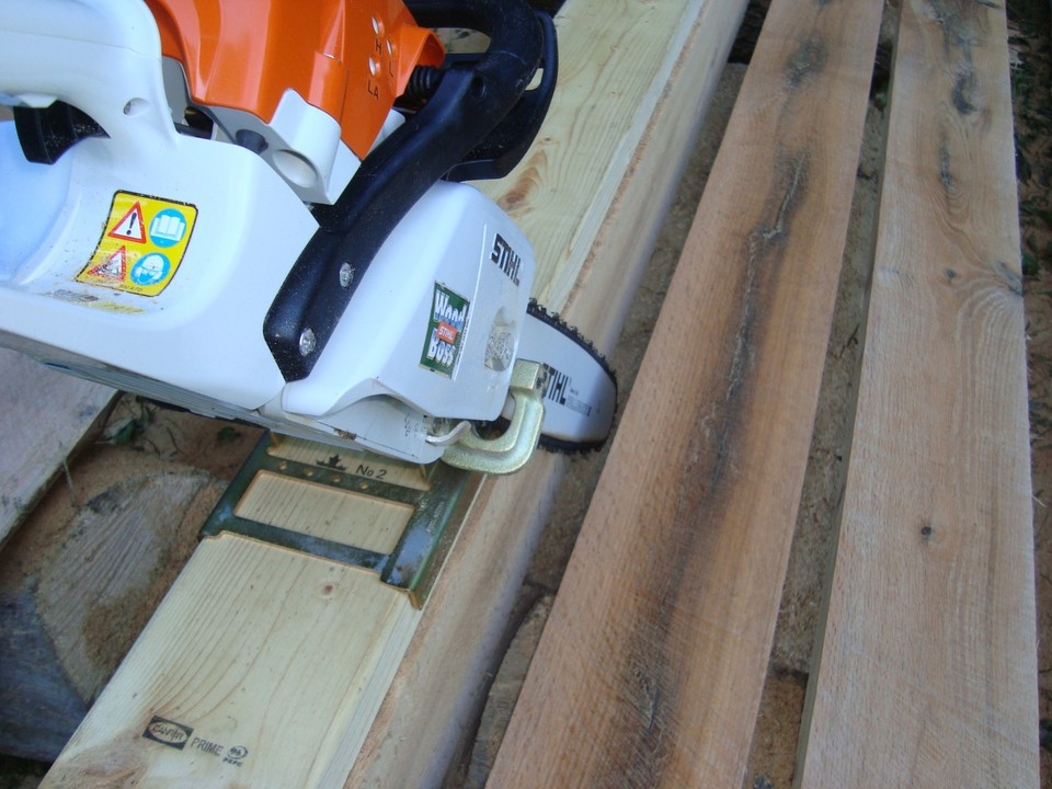 Haddon Lumbermaker lumber tree falls cut off chain saw boards, beams ...