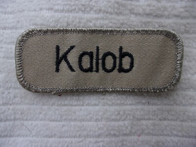 KALOB USED EMBROIDERED SEW ON NAME PATCH TAG BROWN ON TAN | eBay