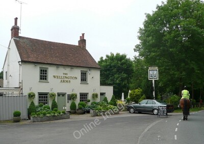 Photo 6x4 Rider at the Wellington Arms Baughurst This is a busy road ...