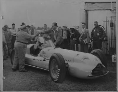 Duke Nalon sits in the Novi Mobil Special outside the garage ar 1949 ...