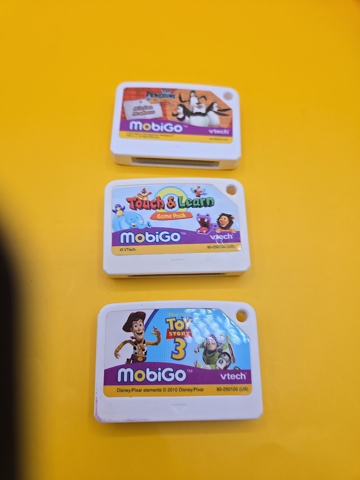 Vtech MobiGo Touch Learning System with 10 Games Dora Cars Mickey Exc ...