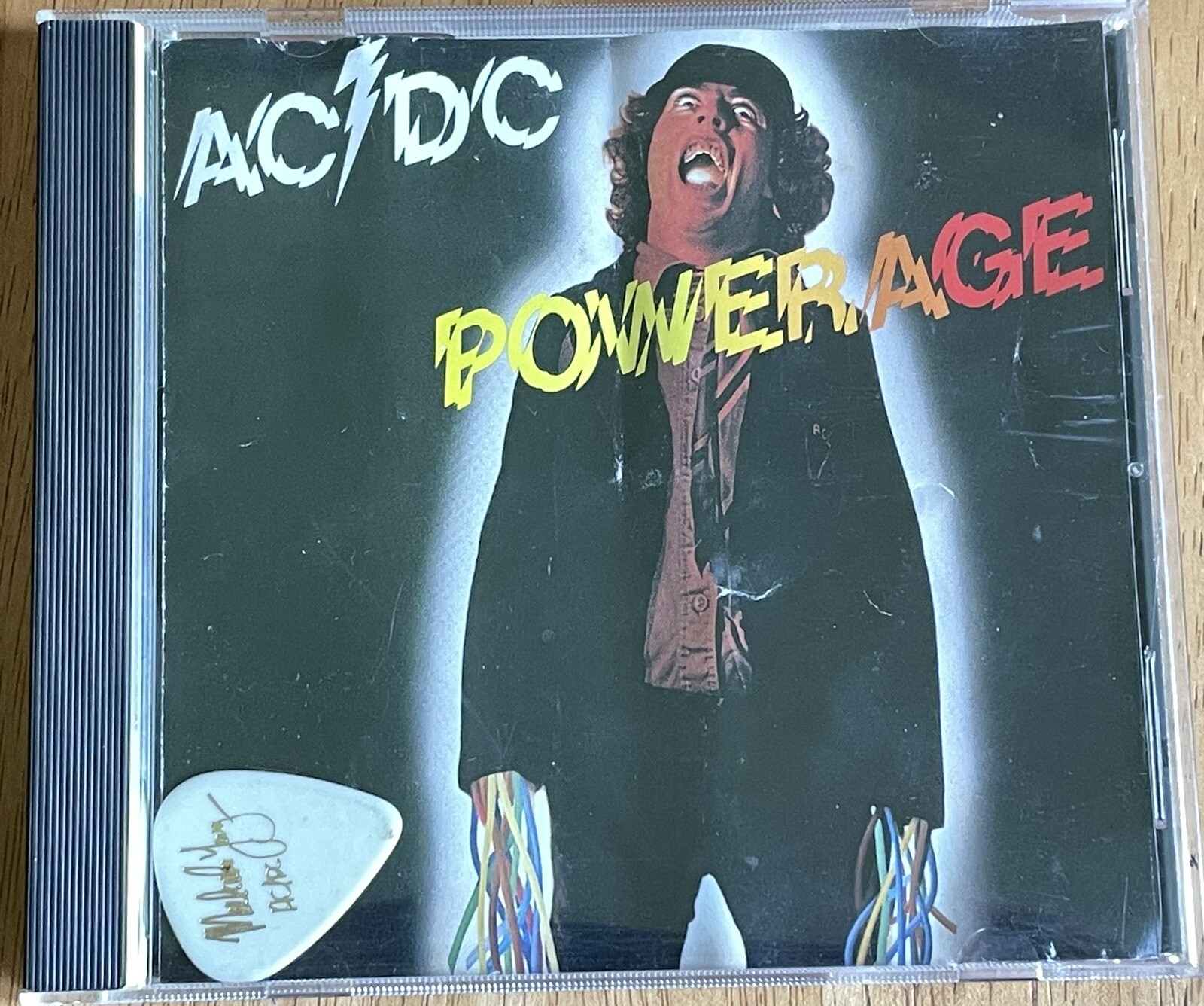 AC/DC Autographed CD "Powerage" with Pick (from collection of ...