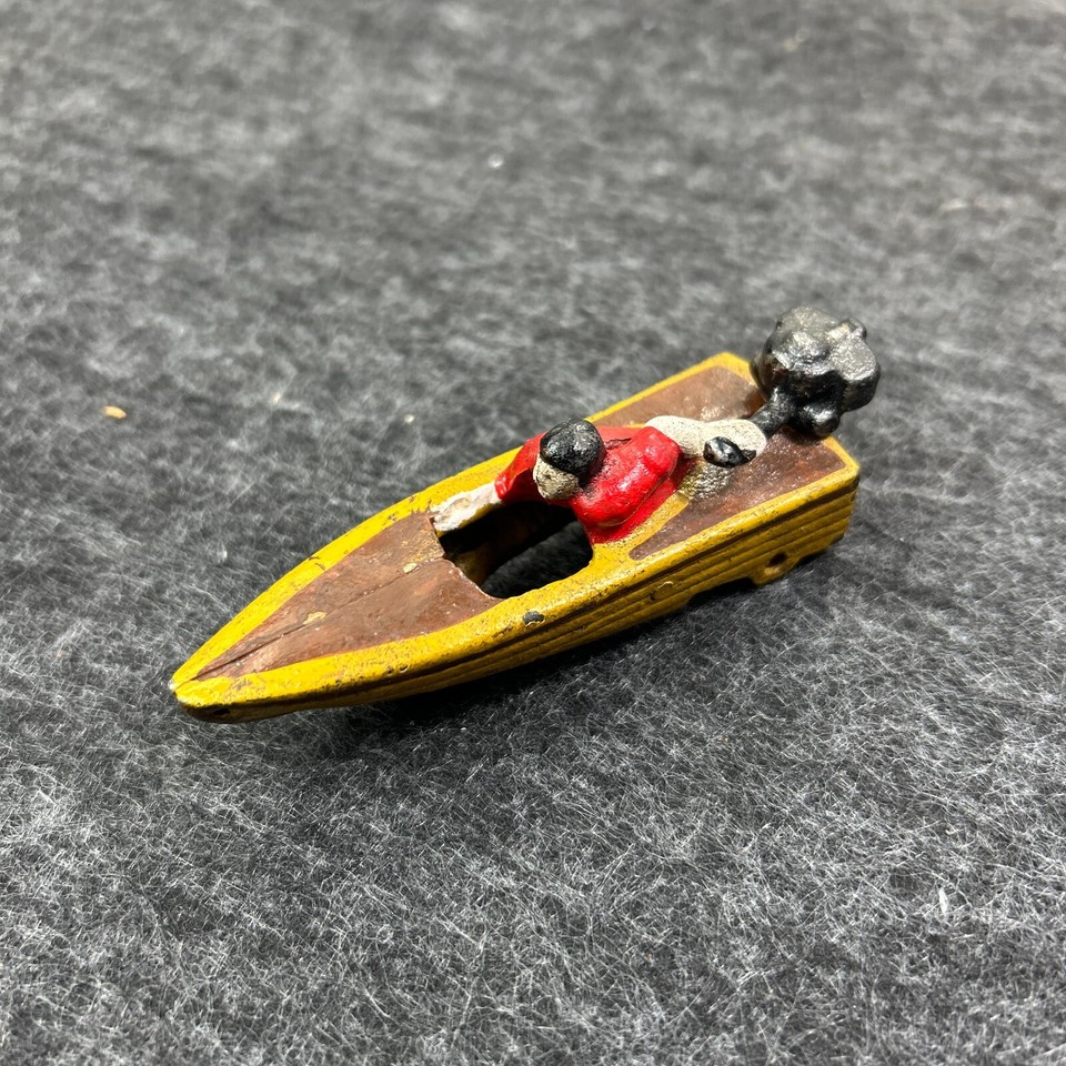 cast iron Yellow speed boat on wheels man driving tiller motor | eBay
