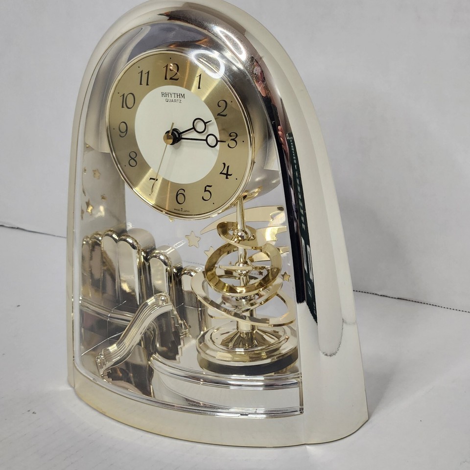 Rhythm Quartz Mantle VTG Clock Rotating Pendulum Silent Stars Celestial ...