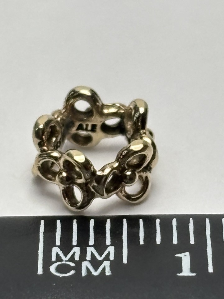 Pandora 14k yellow gold Trinity flower spacer charm with the item ...