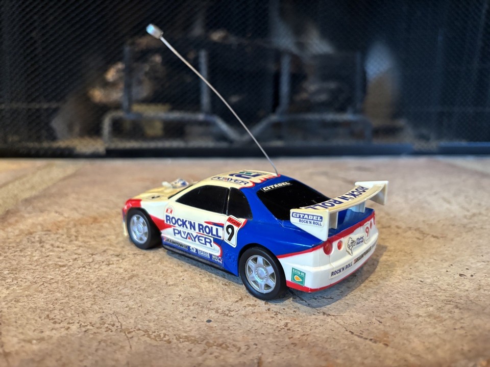 Vintage AULDEY Remote Control Car Nissan GT-R R34 2001 ROCK N ROLL 1:32 ...