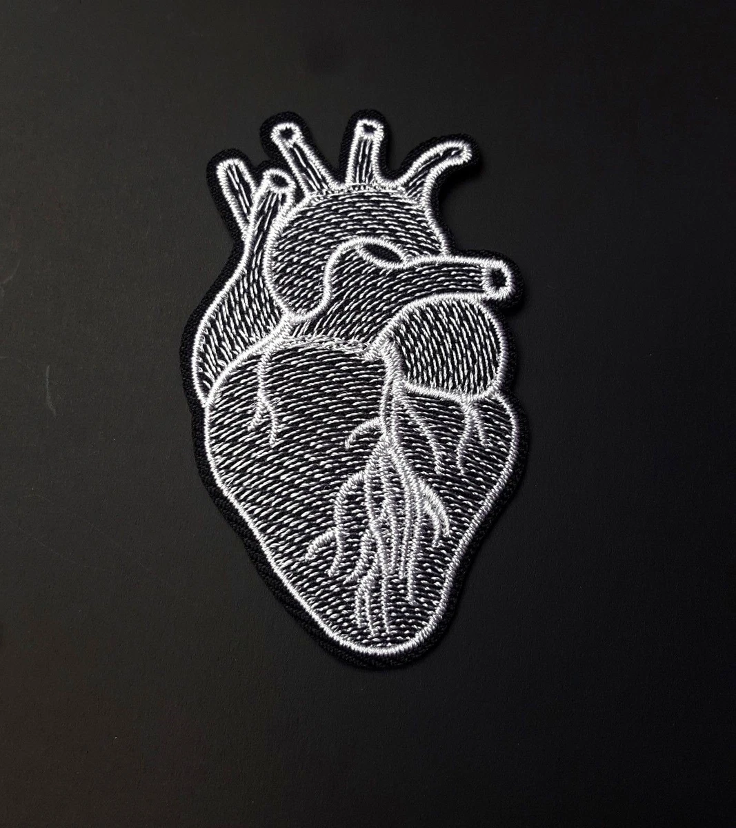 Two Human Hearts Sewn Together