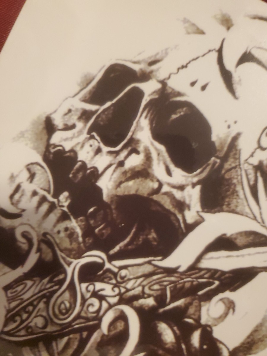 Good And Evil Skull Tattoos