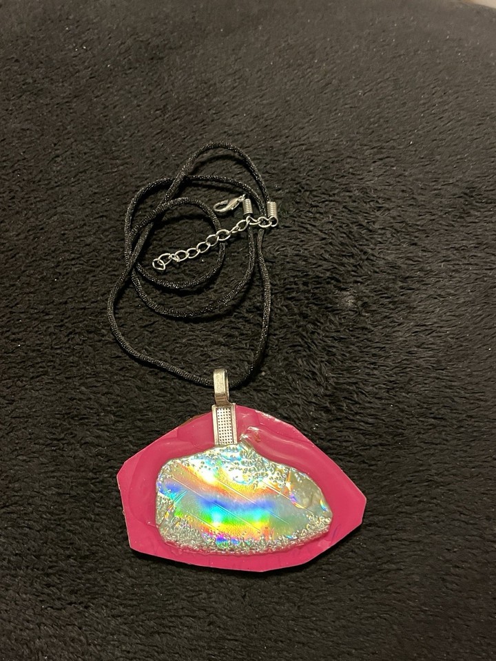 Elegant pink pendant necklace with a black cord. Perfect for any ...