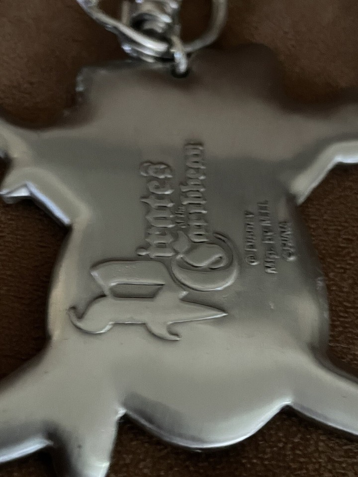 Disney's Pirates of the Caribbean Skull And Swords Pewter Keychain ...