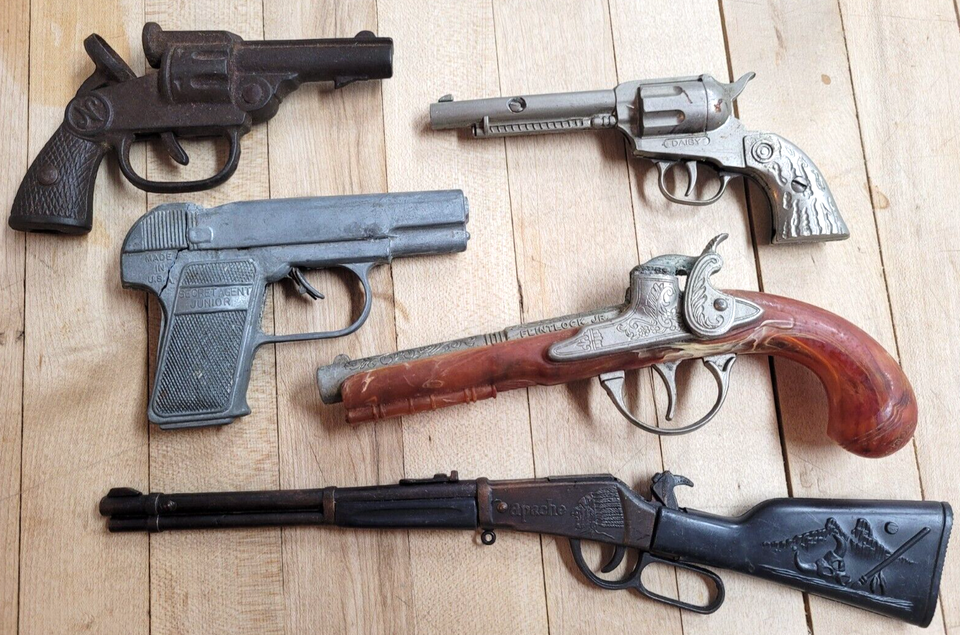 Cap Gun Collection including Cast Iron National, Daisy, Hubley etc ...
