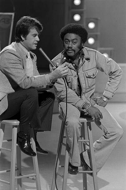 Soul singer Johnnie Taylor performs onstage with host Dick Clark o- Old ...