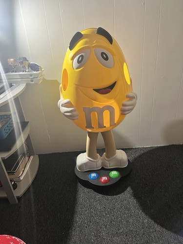 In Store Yellow M&M Display 36” tall without wheels on, 41” tall with ...