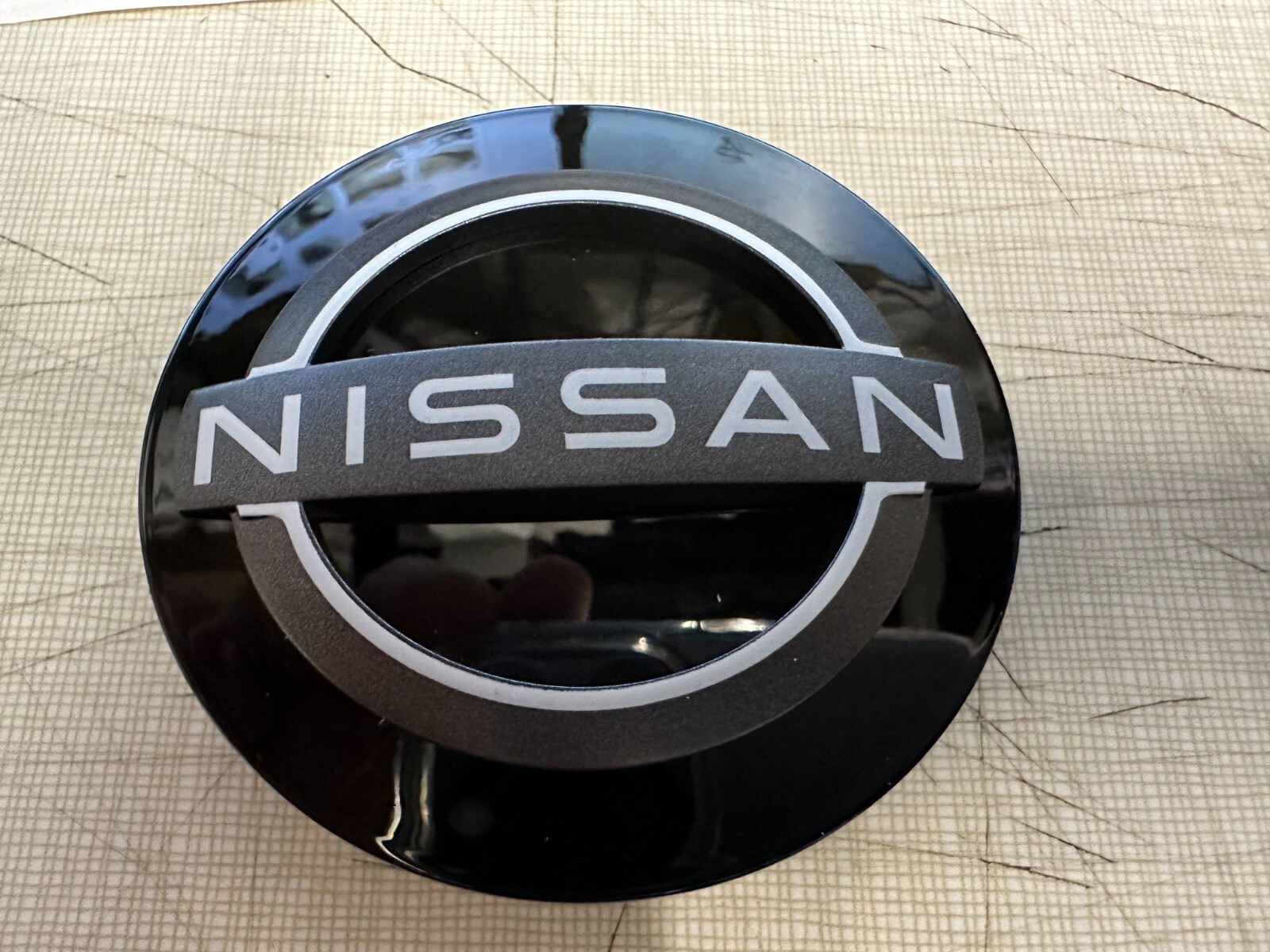 NEW OEM NISSAN CENTER CAP - NEW STYLE / BLACK GLOSS WHITE OUTLINE / SEE ...