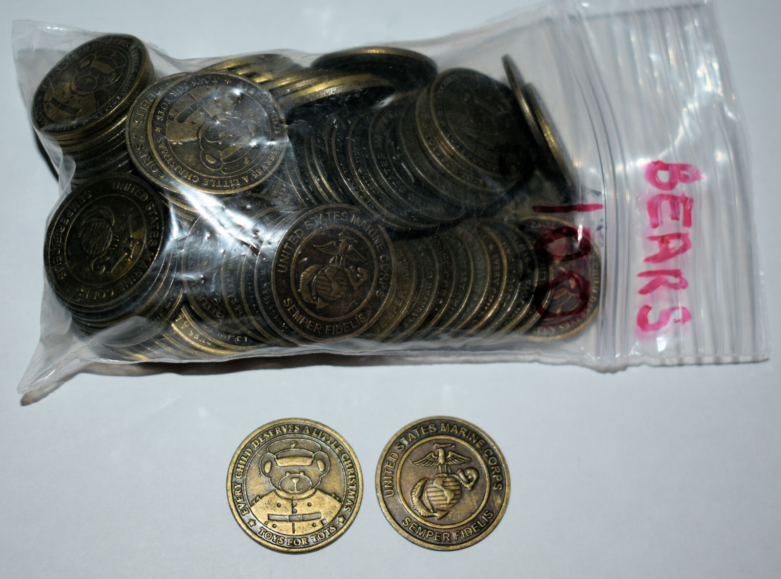 U12. LOT OF 100 TOYS FOR TOTS TOKENS WITH "BEAR" ON REVERSE / USMC ...