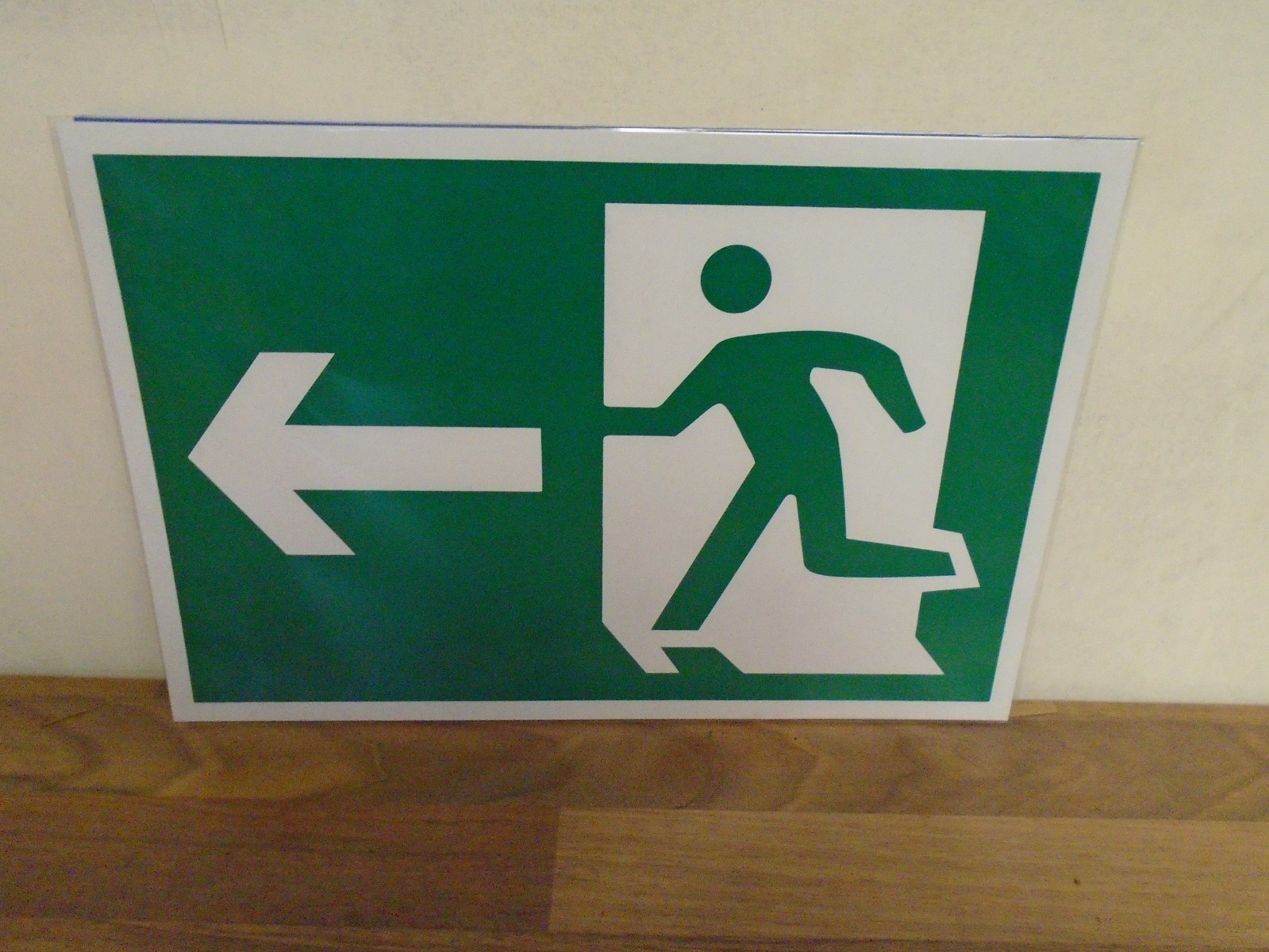 Spectrum Man Running Sign With Left Arrow PVC Self Adhesive Safety Sign ...