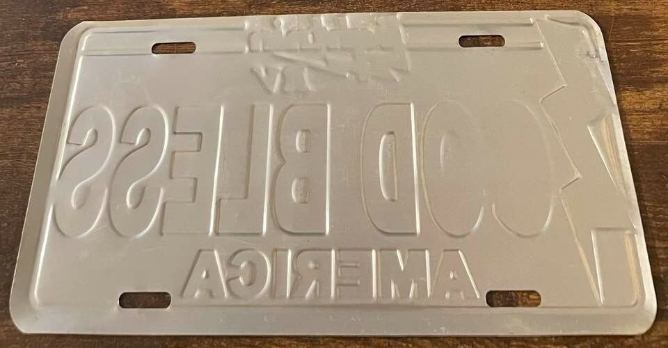 God Bless America Booster License Plate Has Tape at Top Covering RV ...