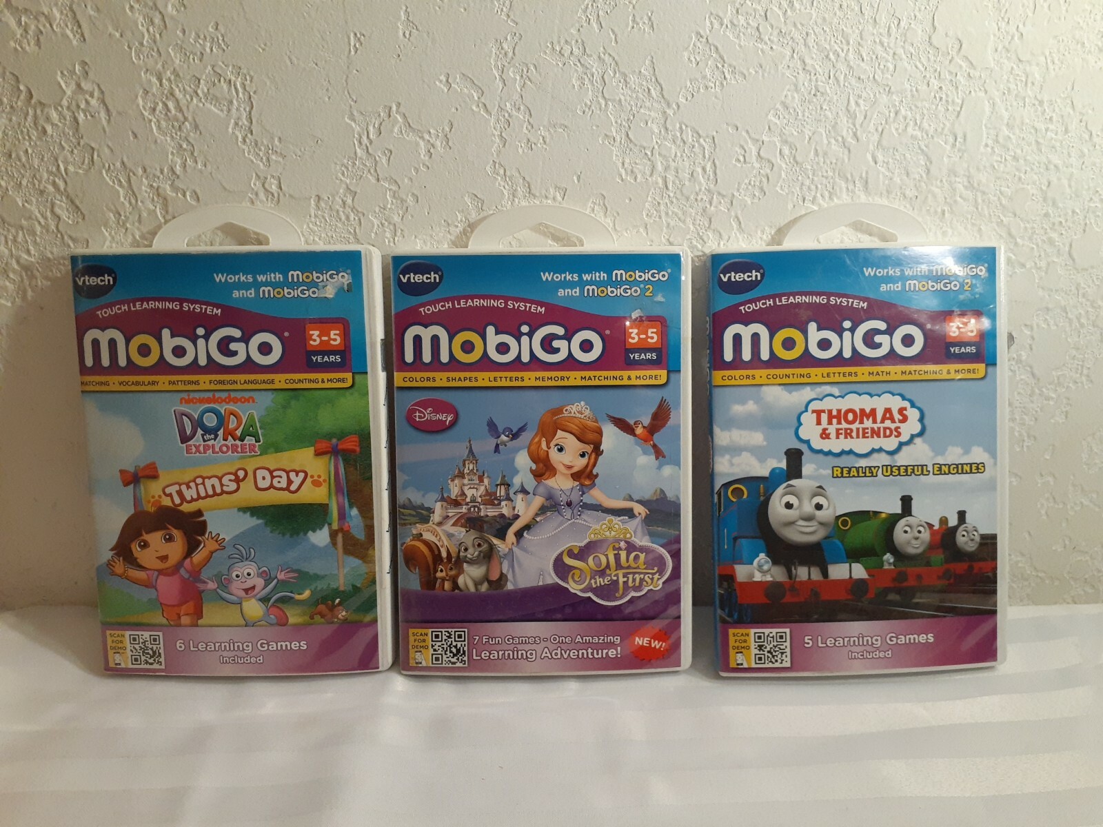 LOT OF 3!!! VTECH MOBIGO LEARNING GAMES/ 3-5 years (Dora, Disney Sofia ...