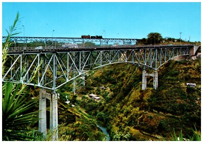 Railroad Train Going over Bridge next to Highway Bridge in Europe 4X6 ...
