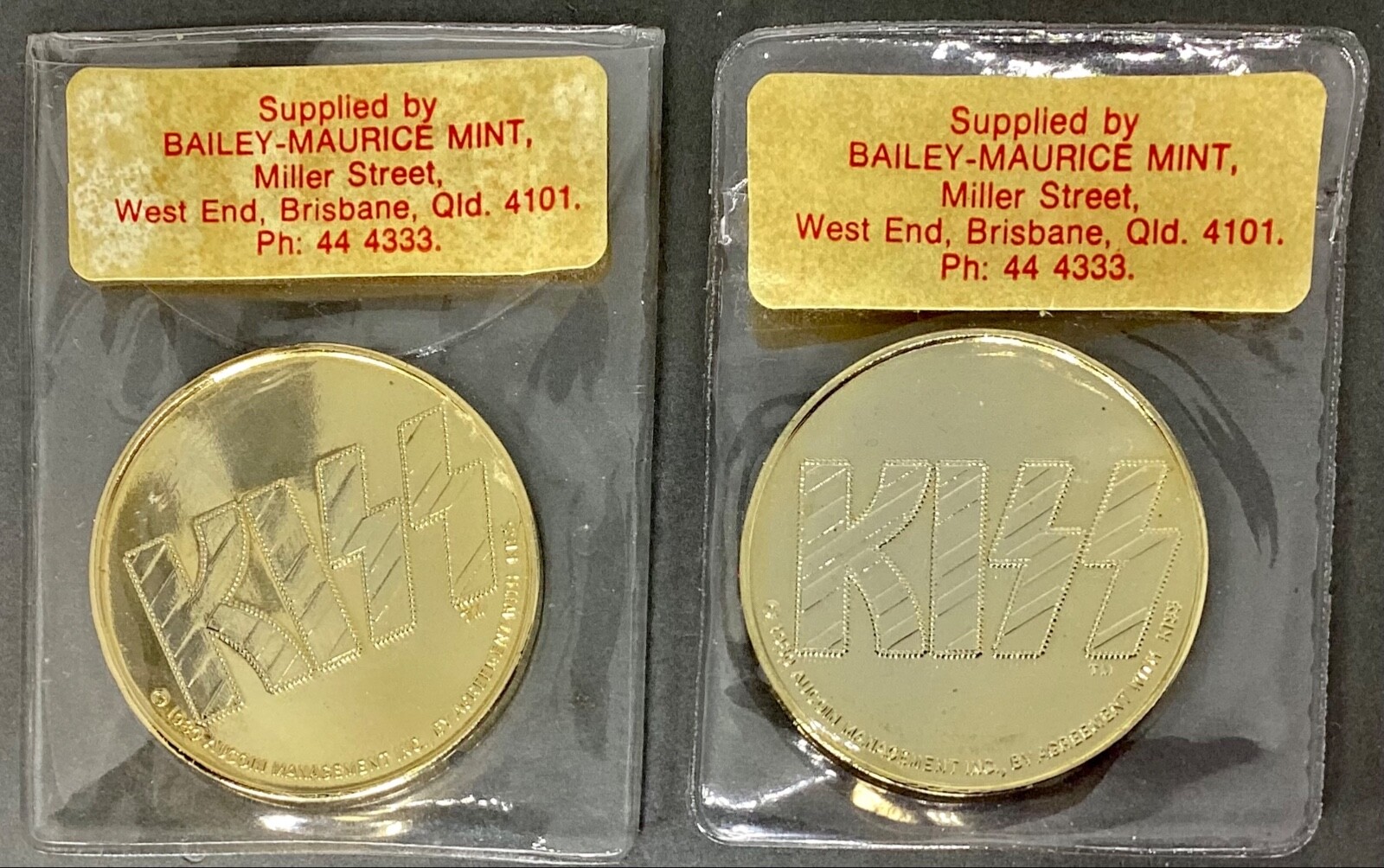 Package of 4 different KISS coins - 2 variations 1980 Oz + red Mardi ...