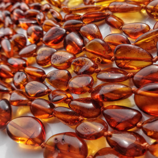 Red Baltic Amber Baltic Amber + Bee Inclusion In Sphere On Carved Red