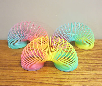 3 NEW MAGIC GLOW IN THE DARK COIL SPRINGS MULTI COLORED 3" PLASTIC COIL ...