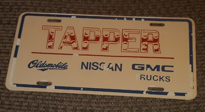 Dealer License plate car TAPPER OLDSMOBILE NISSAN GMC TRUCKS PAW PAW ...