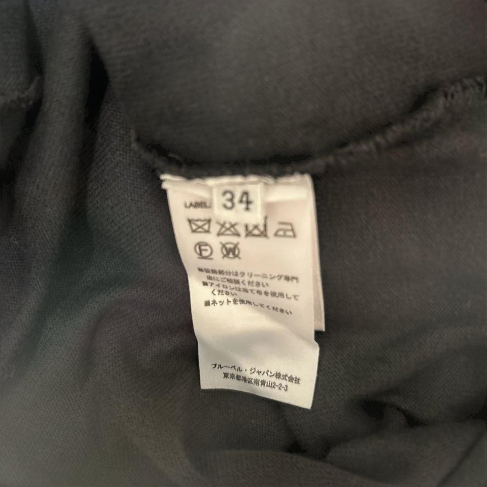 Black high-neck knit shirt by BALMAIN featuring emblem buttons | eBay UK