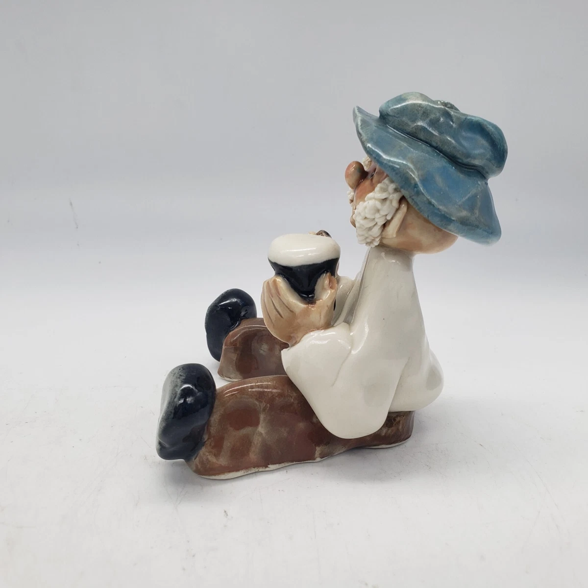 Porcelain Man Reading Irish Times by Gillian Nunan smadiasoft.com