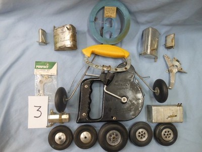 A collection of vintage control line handles and parts with a J-Roberts ...