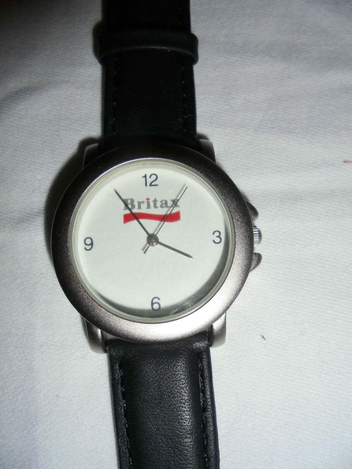NEW WATCH WITH A LEATHER STRAP IT HAS A BRITAX LOGON WANTS NEW BATTERY ...