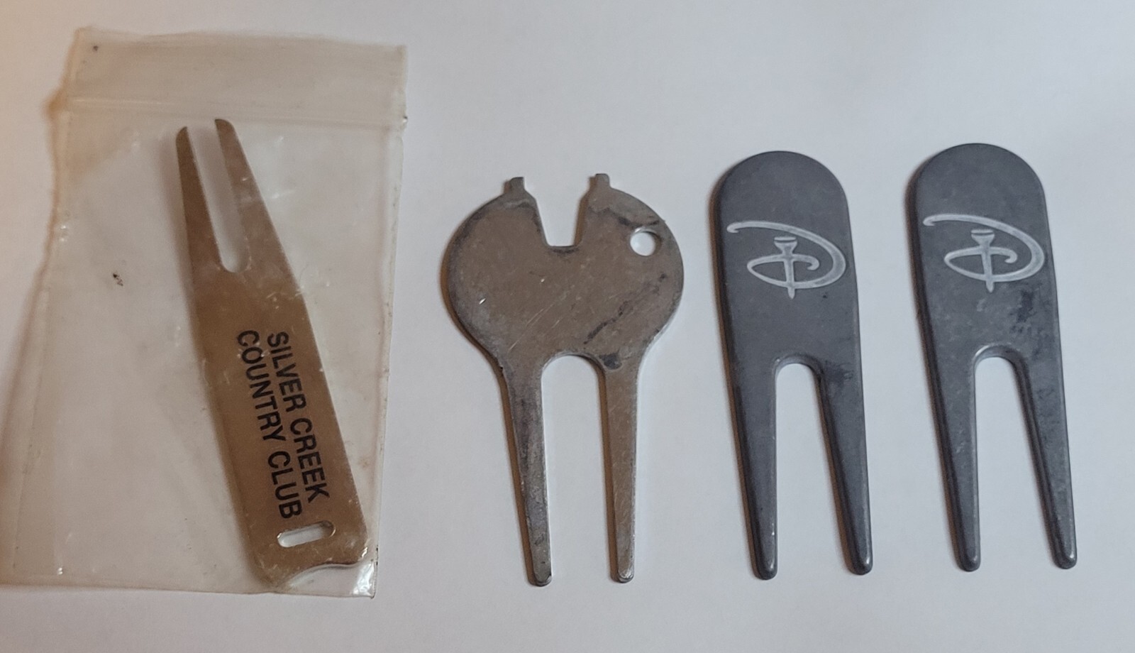 Lot Of 4 Golf Tee Pullers Misc. Disney,Silver Creek | eBay