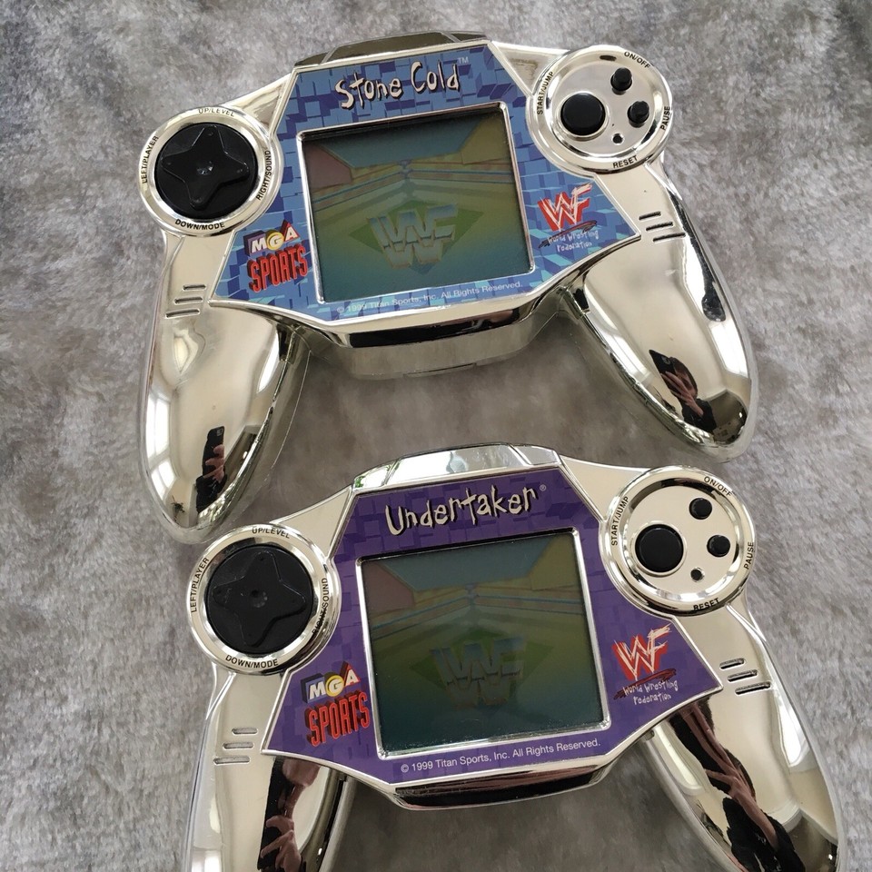 Vtg 1999 WWF Stone Cold Vs. Undertaker Hand Game Controllers MGA Sports ...