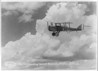 General Billy Mitchell aloft in biplane,aerial bombing exercise,July ...