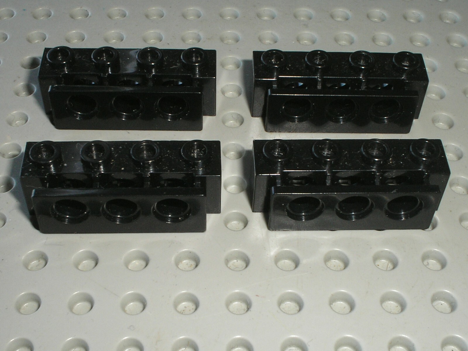 4 x LEGO Black Technic Brick 1x4 with Bumper Holder Ref 2989 Set 7243 ...