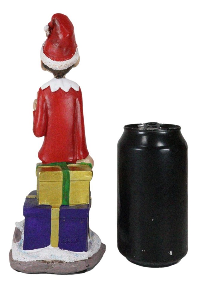 Naughty Christmas Elf Flipping The Bird Sitting On Santa Presents Shelf ...