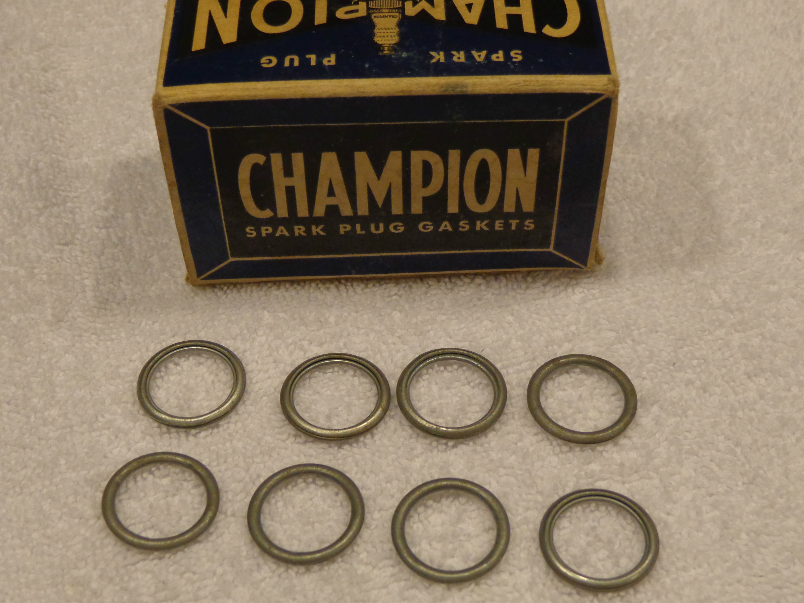 (8) ... ‘NOS’ Champion 18mm Spark Plug Gaskets ... Steel ... Made in ...