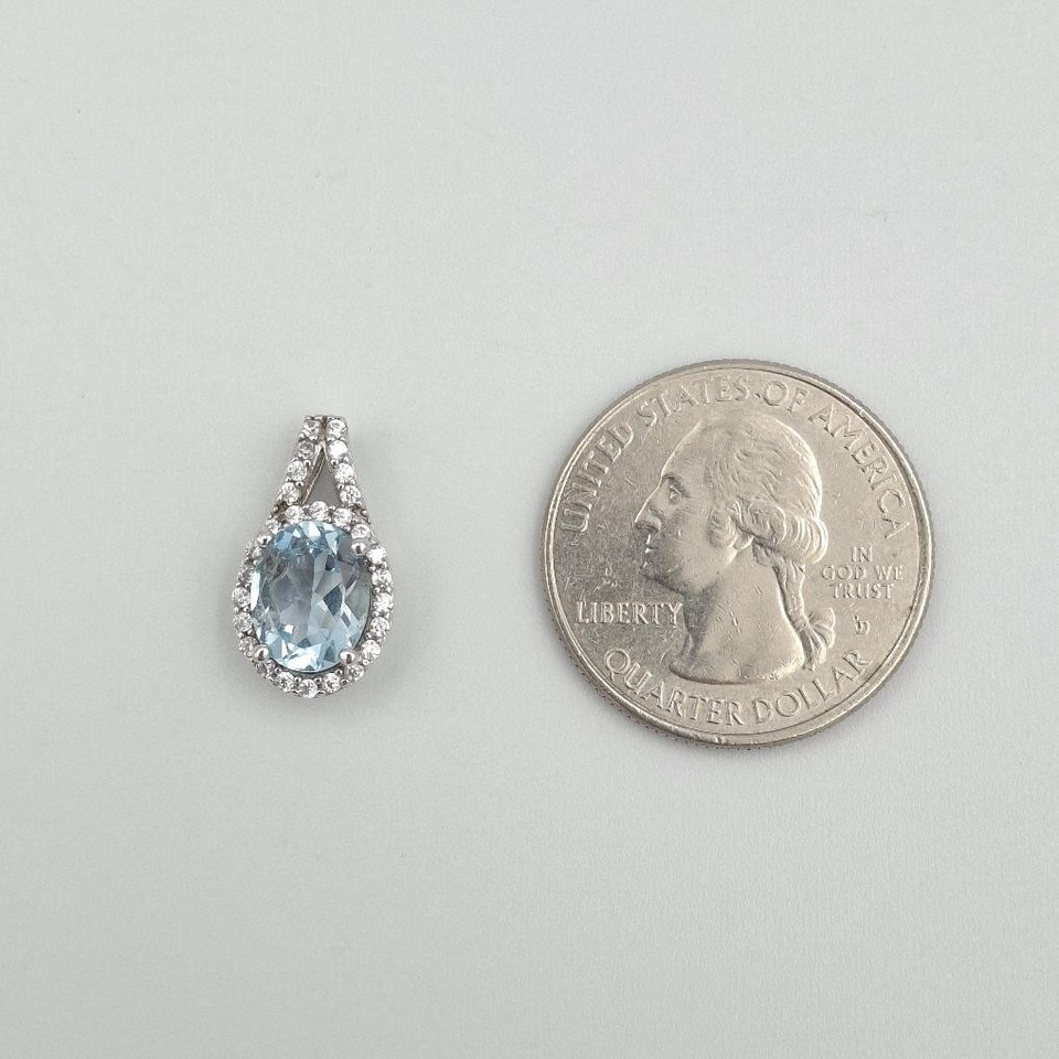 925 Sterling Silver Oval Light Blue Topaz & Cubic Zirconia CZ Halo ...