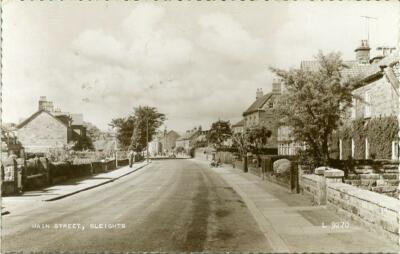 REAL PHOTO POSTCARD OF MAIN STREET, SLEIGHTS, (NEAR WHITBY), NORTH ...