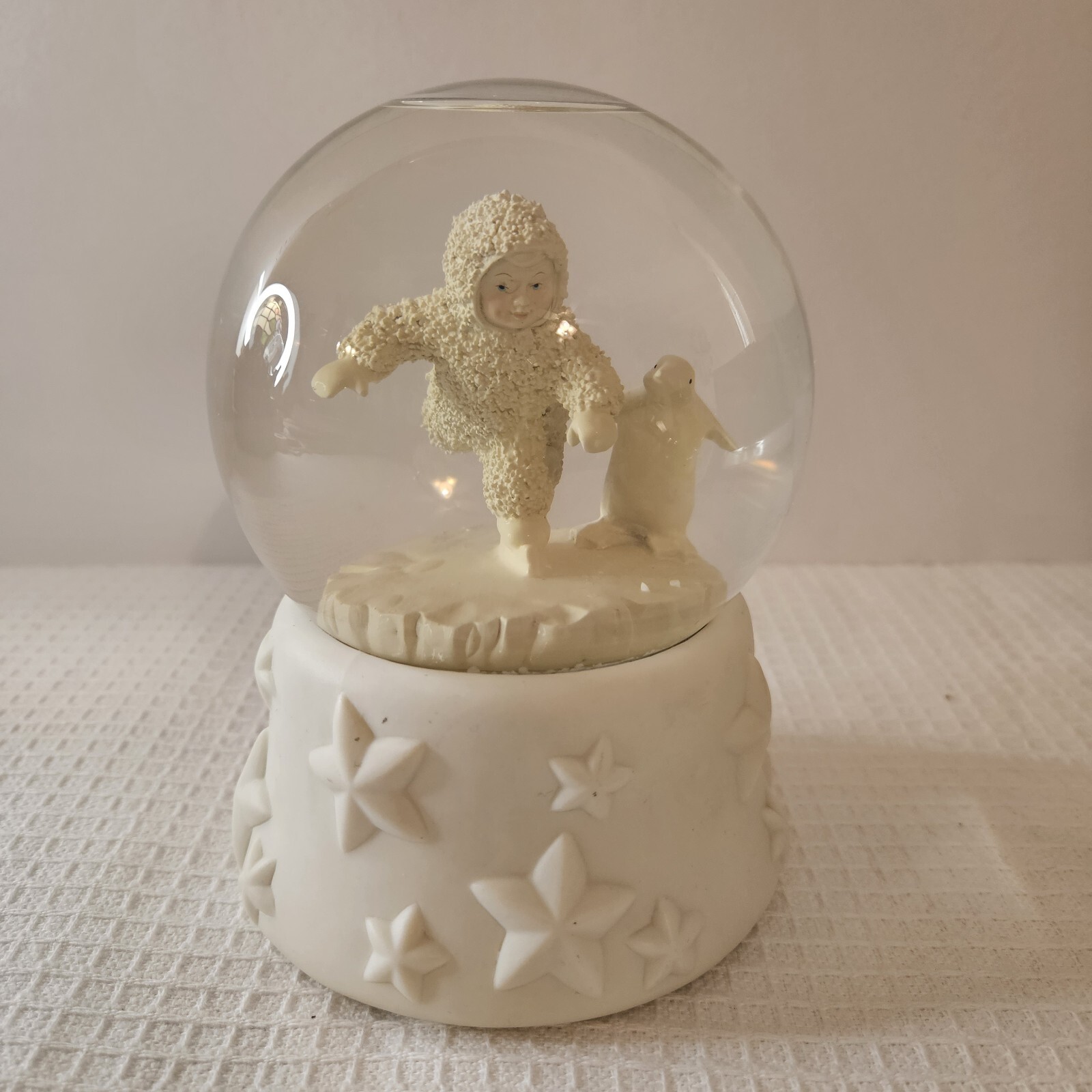 Department 56 Musical Snow Globe. Endearing Snowbaby ice skating with a ...