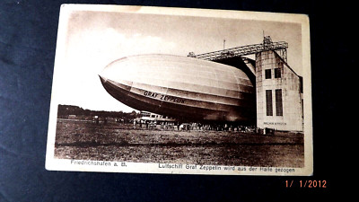 German Zeppelin Postcard - The Graf Zeppelin Led out of the Great Hall ...