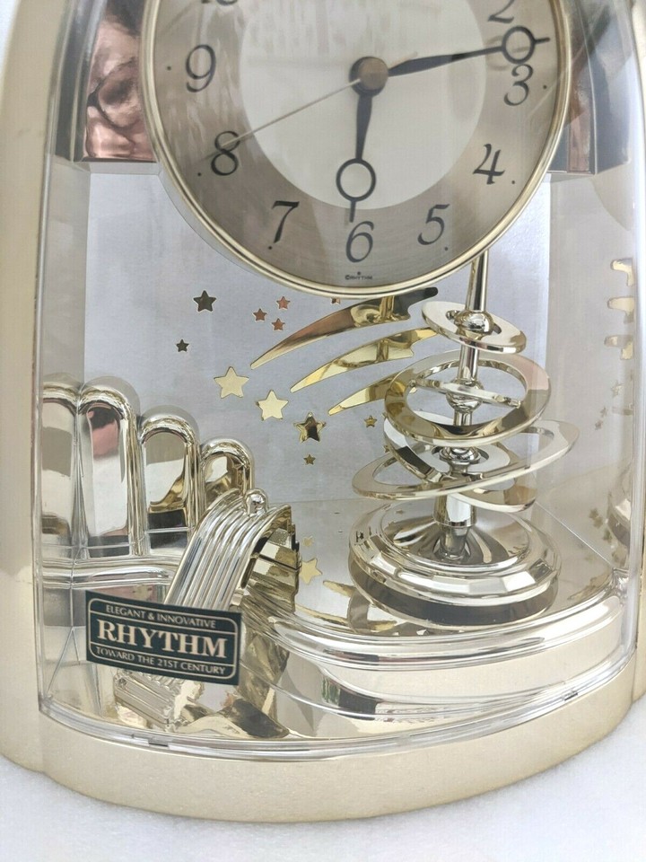 WW. RHYTHM Contemporary Motion Desk Clock Rotating Pendulum Gold Color ...