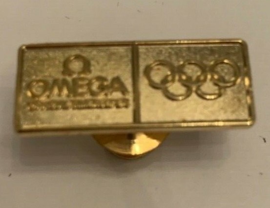 Omega Olympic Official Timekeeper pin badge - Gold coloured | eBay