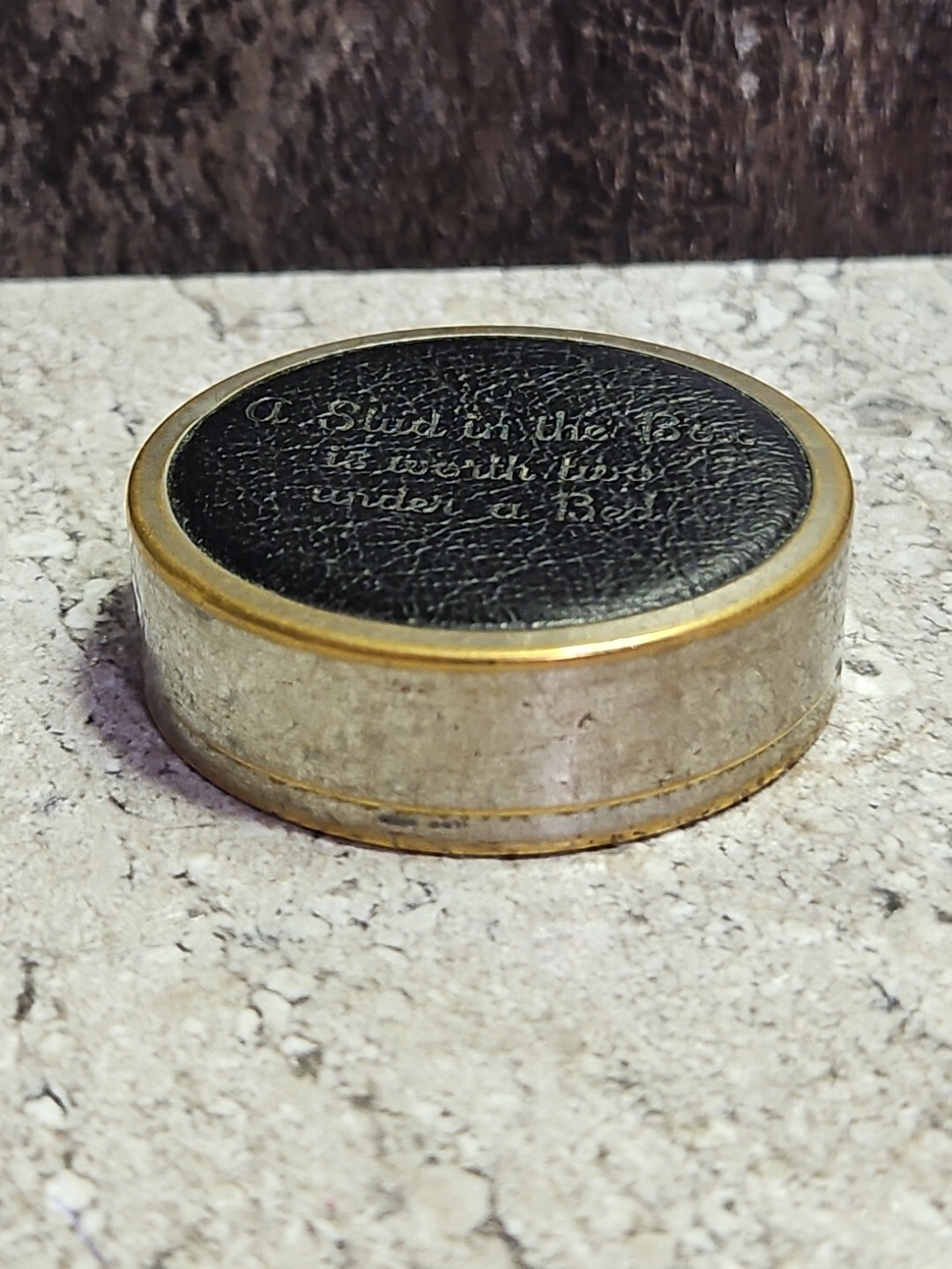 Old shirt studs box, inscribed " A Stud in the Box is worth two under ...