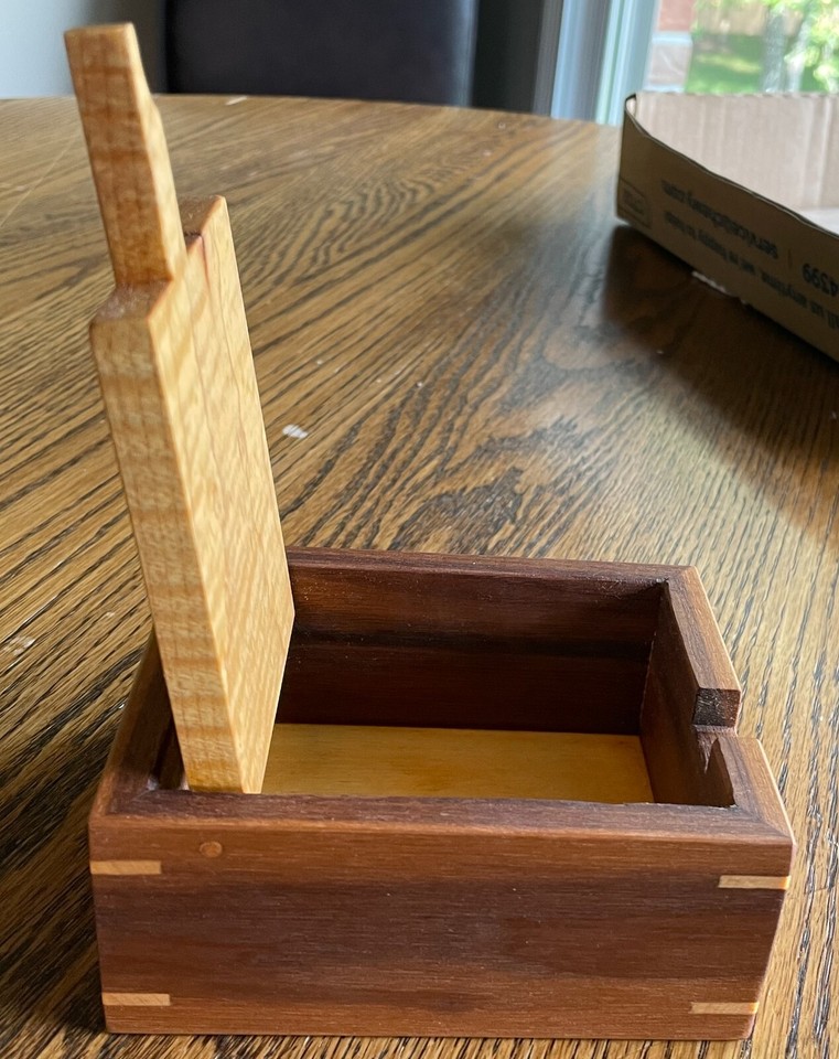 Handmade hinged walnut and maple box, artist's name on bottom, sides ...