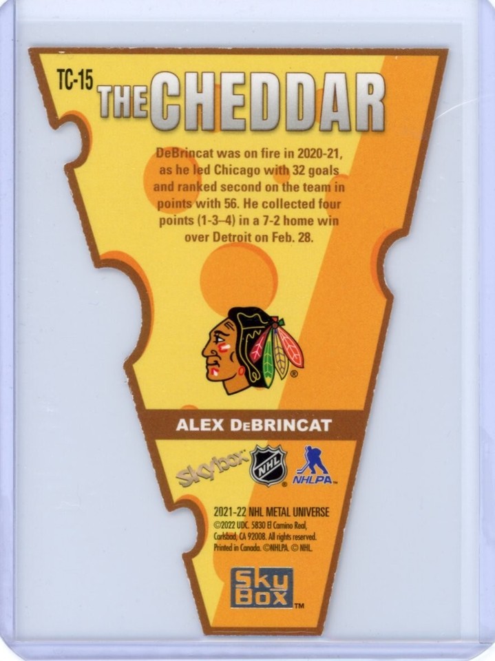 2021-22 Metal Universe Alex DeBrincat The Cheddar - Chicago Blackhawks ...