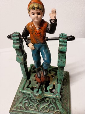 ANTIQUE VINTAGE STYLE - BOY ON TRAPEZE CAST IRON COIN BANK ...