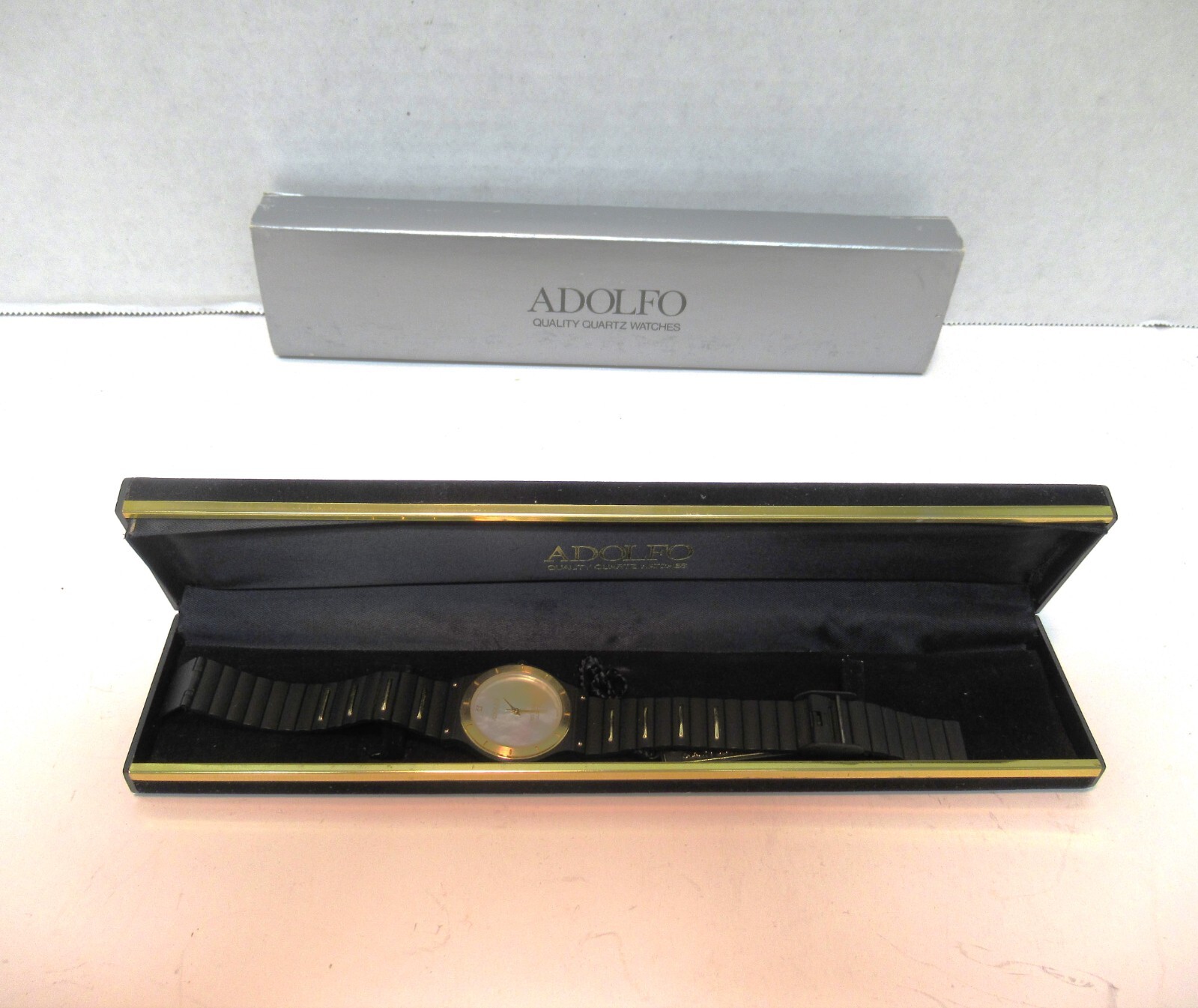 VINTAGE ADOLFO QUARTZ WATCH NEW IN CASE MOTHER OF PEARL FACE BLACK/GOLD ...