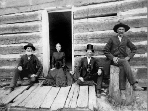 *Postcard-"Cabin Made of Lincoln Logs" ...-Men & Lady...Sit on Porch ...