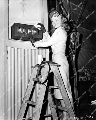 crp-16505 1945 Janet Blair polishing air raid warning sign film Tonight ...